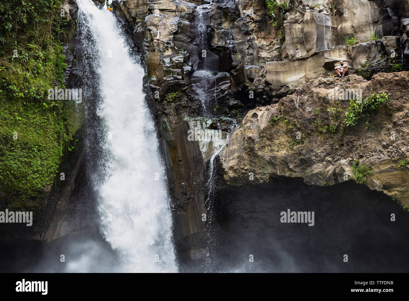 Tourist Enjoying Tegenungan Waterfall in Bali, Indonesia Stock Photo ...