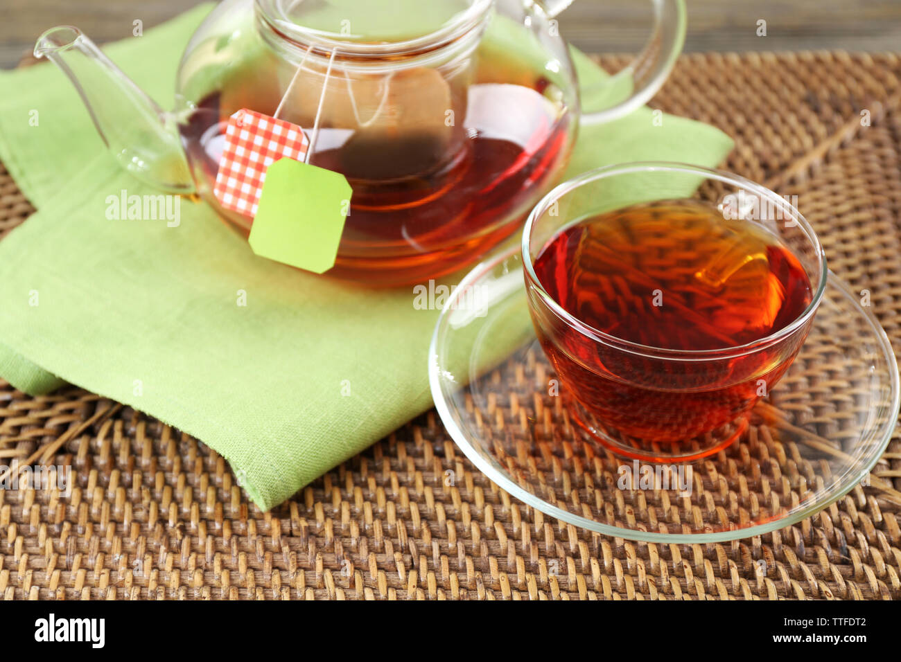 Cup of tea with tea bags and teapot on wooden table background Stock ...