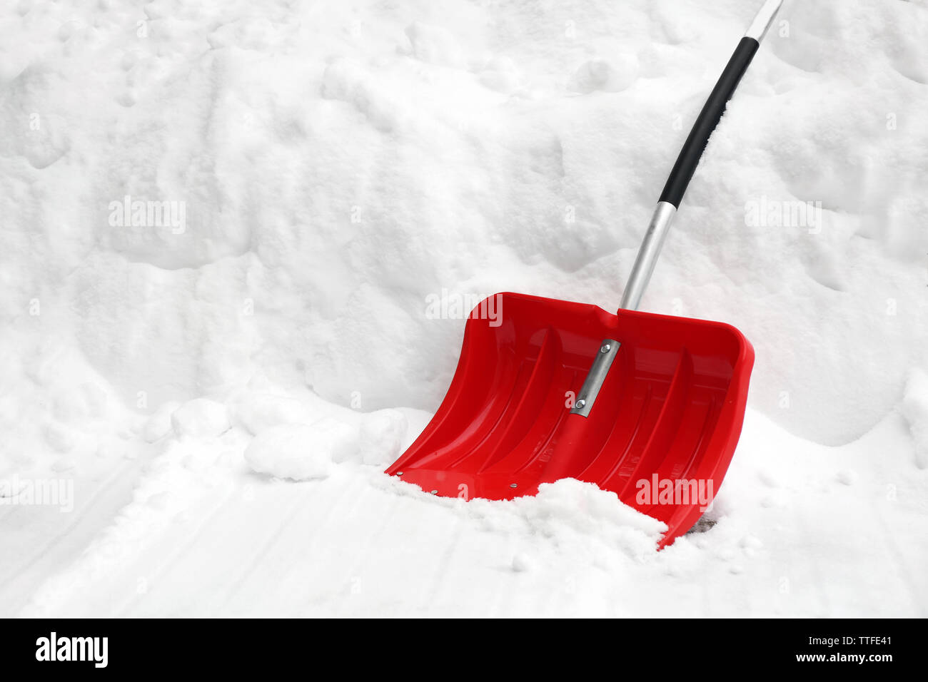 Red shovel for snow removal Stock Photo - Alamy