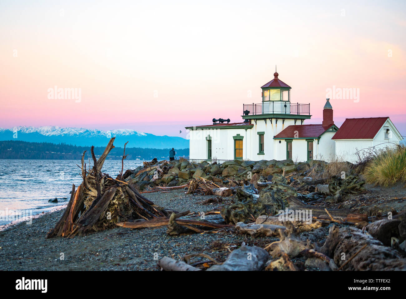 Lighthouse at sunrise Stock Photo - Alamy