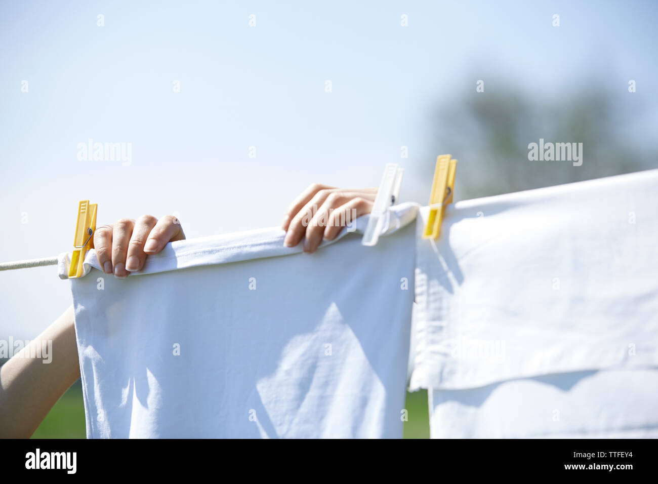 Woman drying clothing hi-res stock photography and images - Alamy