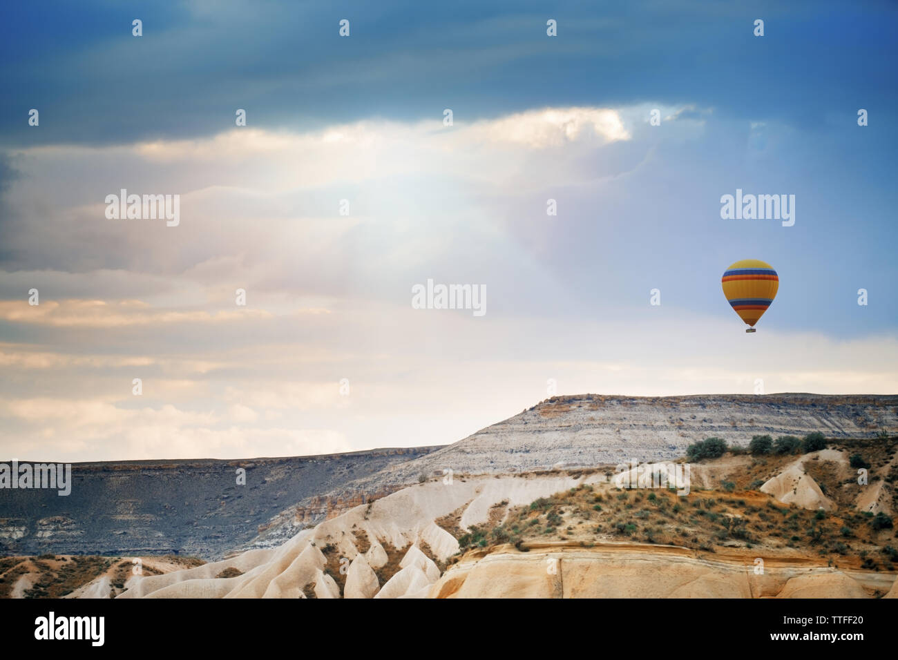 Hot air balloon flying over the rocks Stock Photo - Alamy