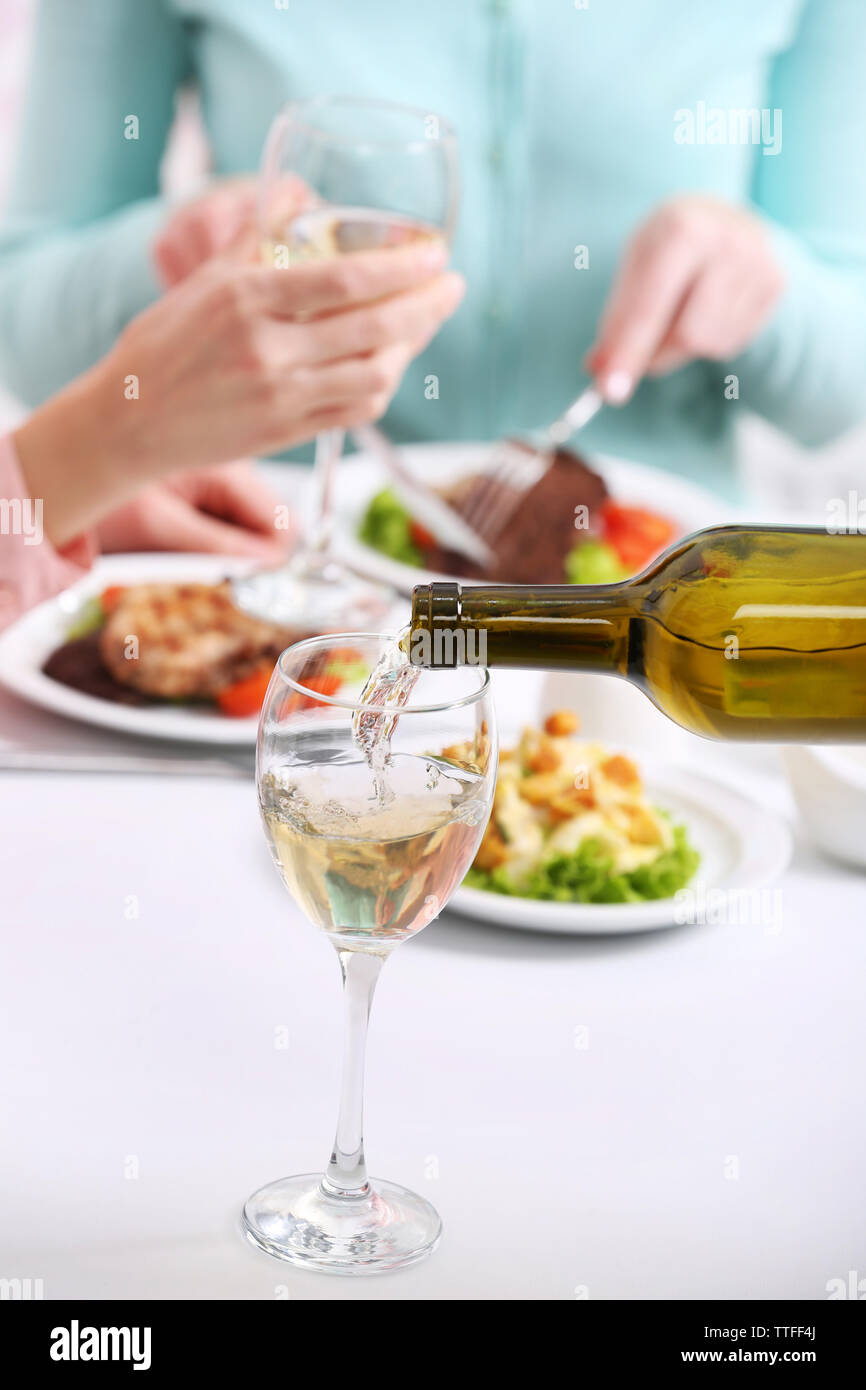 Dinner with wine in restaurant Stock Photo - Alamy