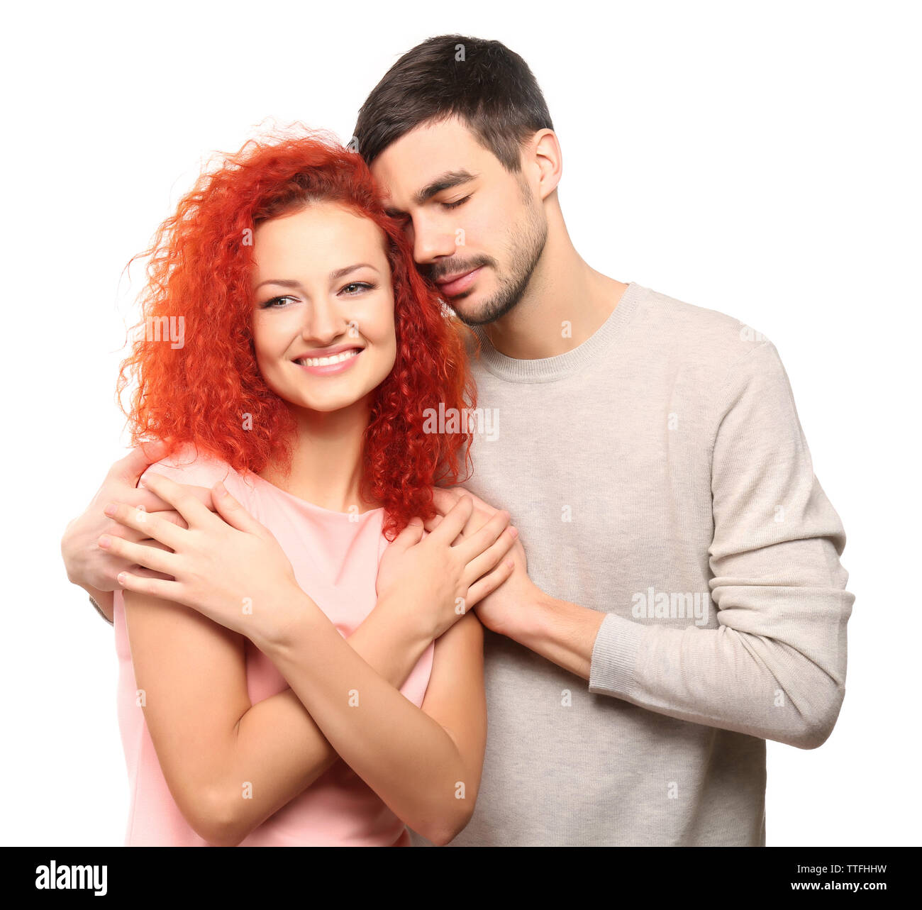 Happy young couple in love embracing, isolated on white Stock Photo - Alamy