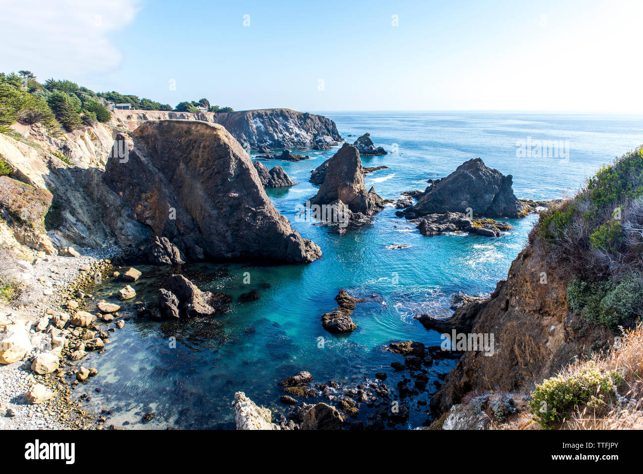 View of rocky cove with blue ocean from headlands Stock Photo - Alamy