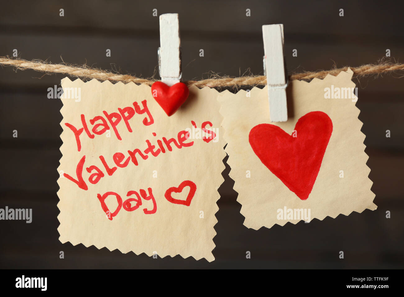 Valentine's Day card with hearts and words of love on wooden background ...