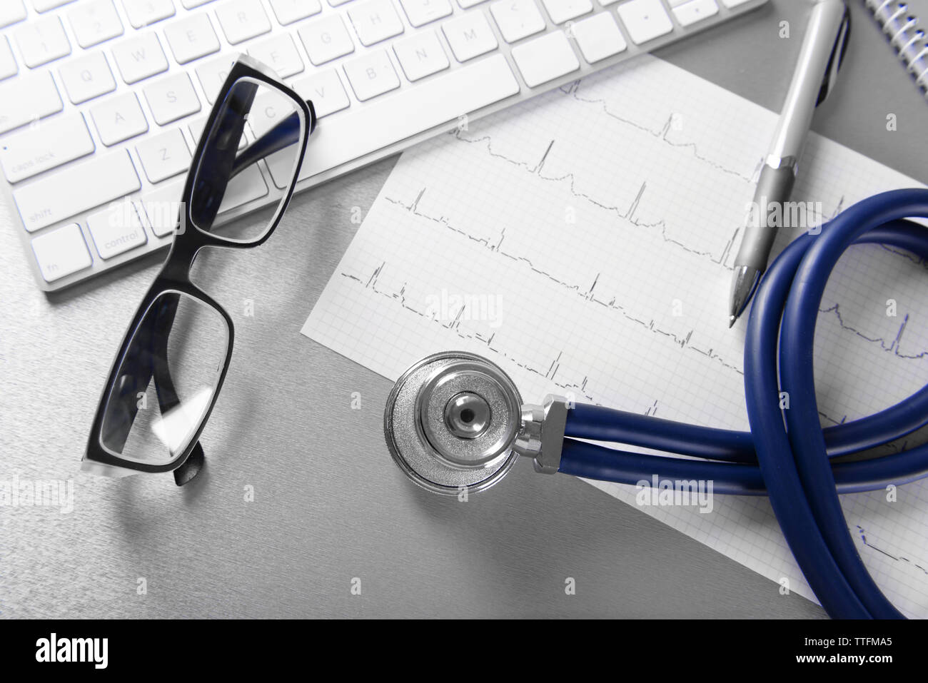 Cardiogram chart with medical stethoscope on grey background Stock ...