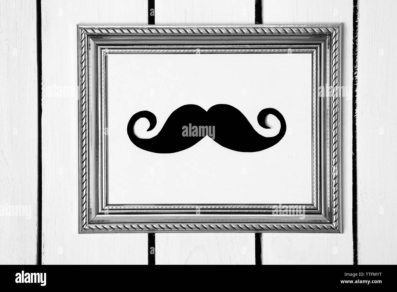 Black mustache on wooden Black and White Stock Photos & Images - Alamy