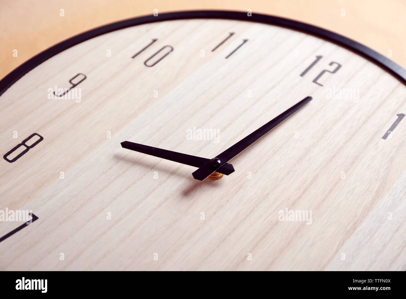 Wooden clock face closeup Stock Photo - Alamy