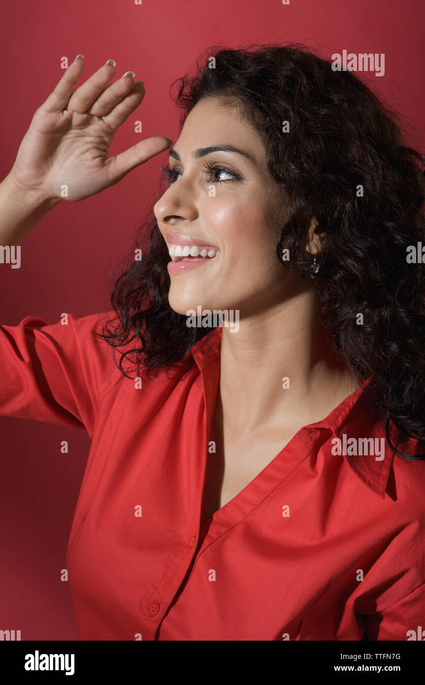 Shielding her face and eyes with hand hi-res stock photography and ...