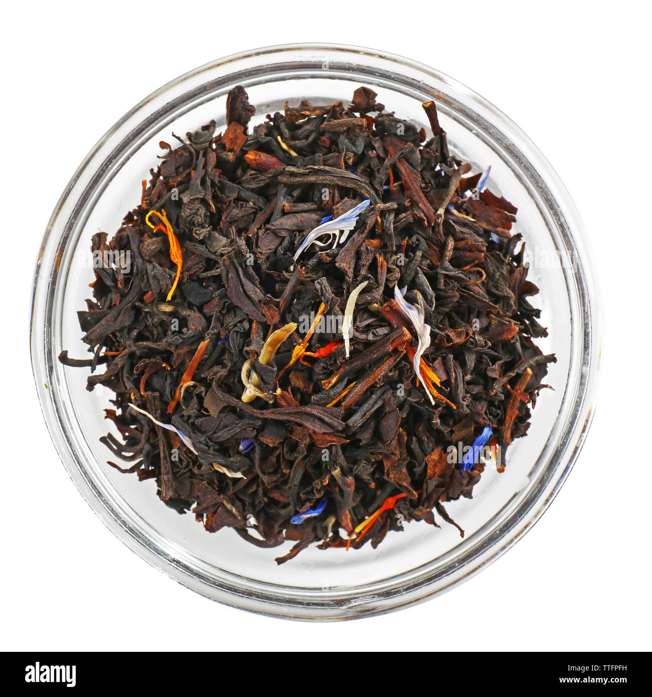 Dry tea leaves in bowl, isolated on white Stock Photo - Alamy