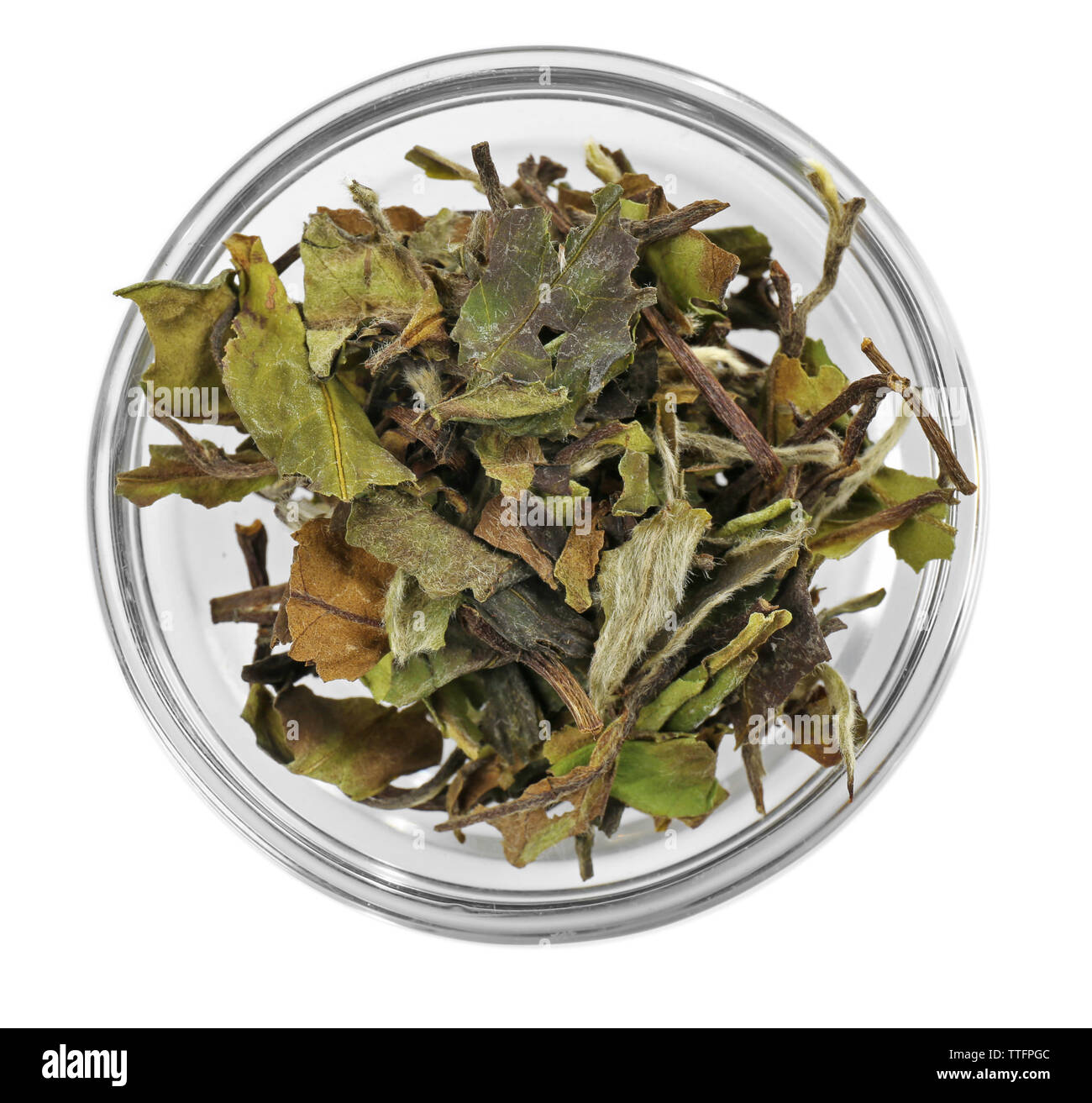White tea leaves in bowl, isolated on white Stock Photo - Alamy
