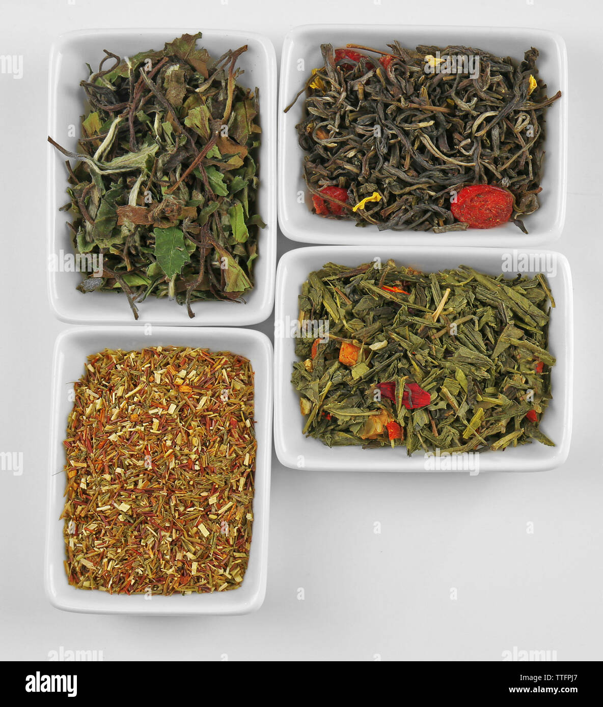 Variety of tea leaves, isolated on white Stock Photo - Alamy