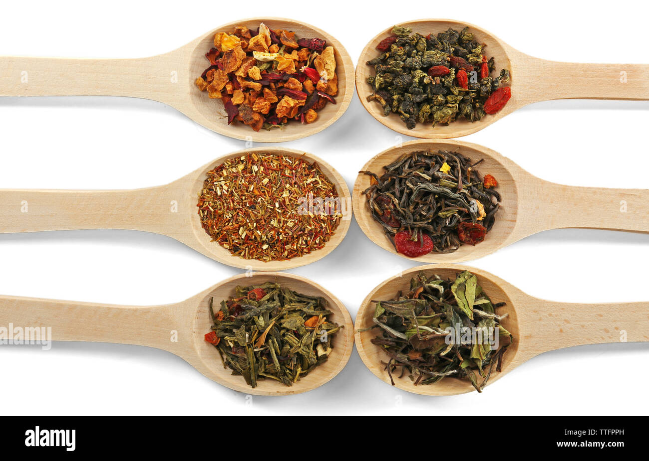Variety of tea leaves in wooden spoons, isolated on white Stock Photo ...