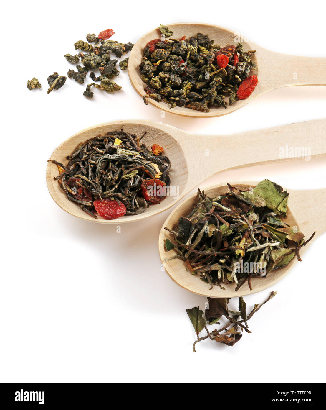 Variety of tea leaves in wooden spoons, isolated on white Stock Photo ...