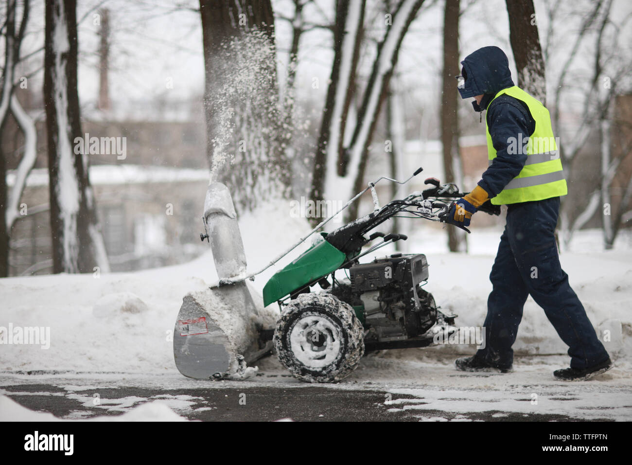Man cleans snow machine road hi-res stock photography and images - Alamy