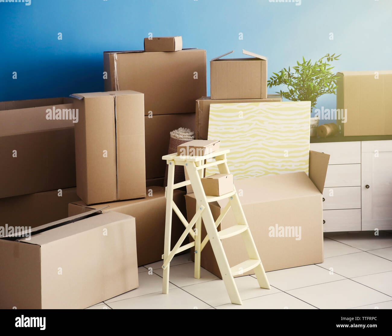 Packed household goods for moving into new house Stock Photo - Alamy