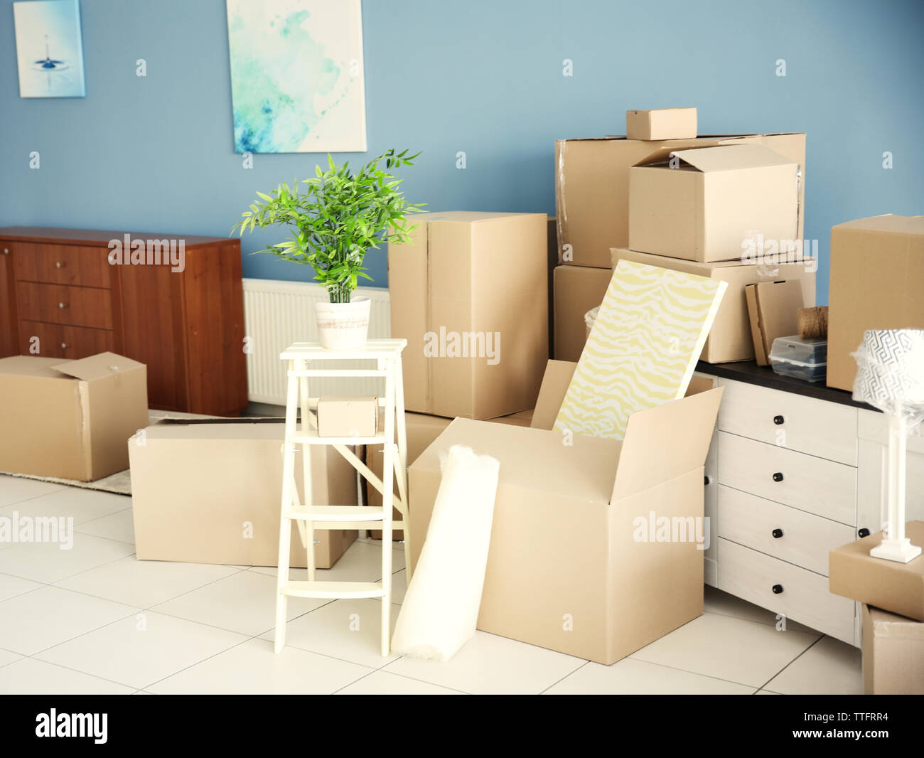 Packed household goods for moving into new house Stock Photo - Alamy