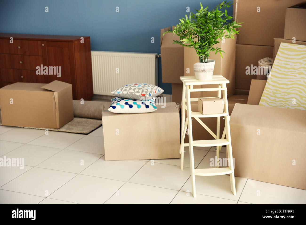 Packed household goods for moving into new house Stock Photo - Alamy