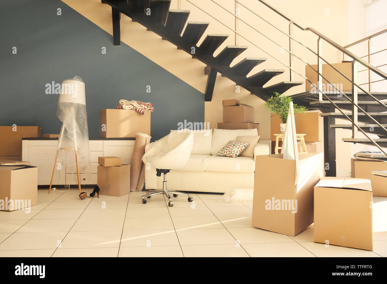 Packed household goods for moving into new house Stock Photo - Alamy