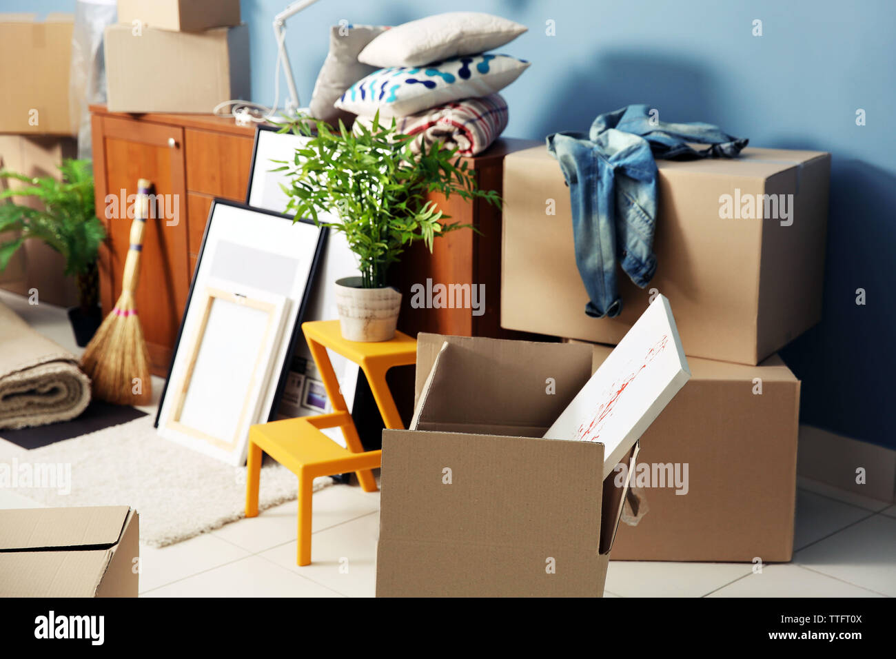 Packed household goods for moving into new house Stock Photo - Alamy