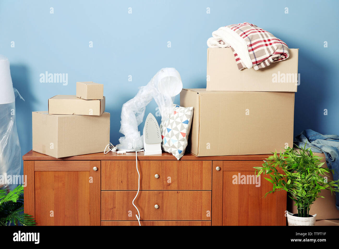 Packed household goods for moving into new house Stock Photo - Alamy