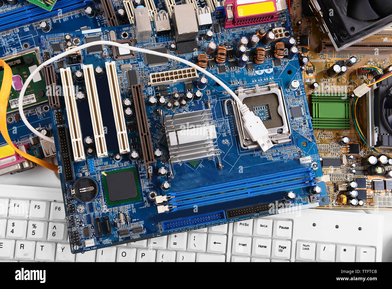 Computer motherboards with keyboard, close up Stock Photo - Alamy