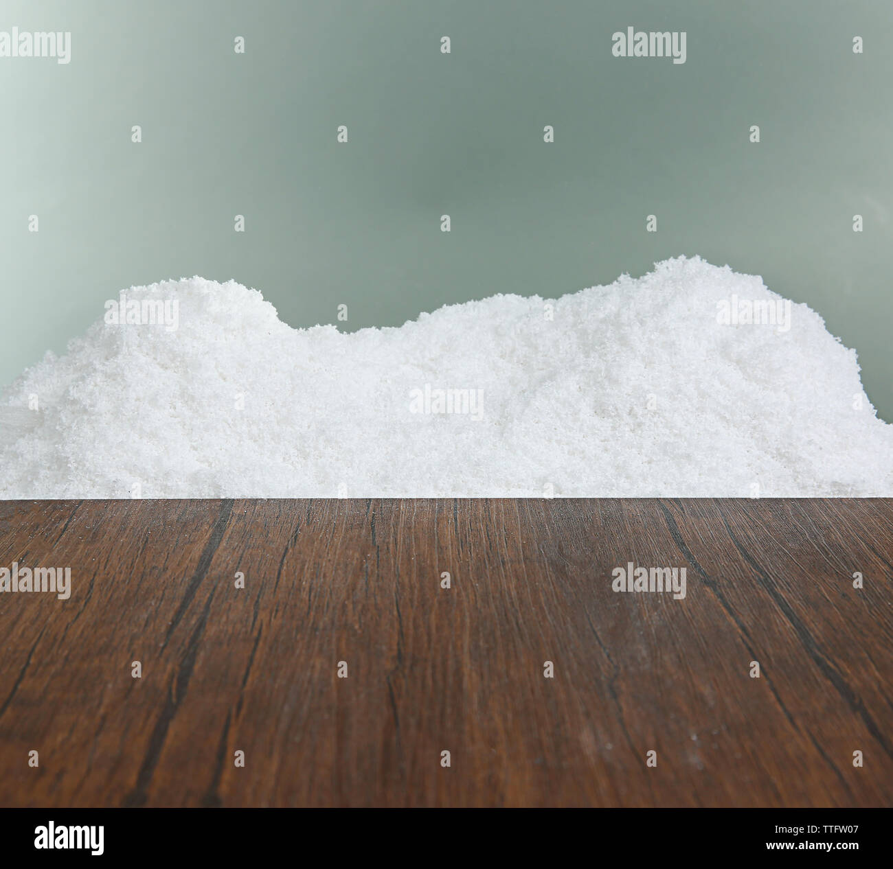 Brown wood panel with snow on grey background Stock Photo - Alamy