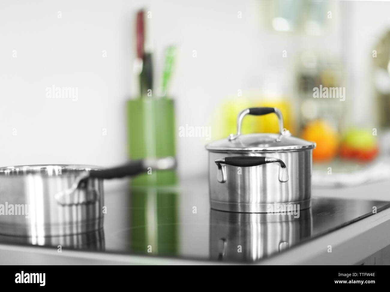 Modern electric stove with pan in the kitchen, close up Stock Photo - Alamy