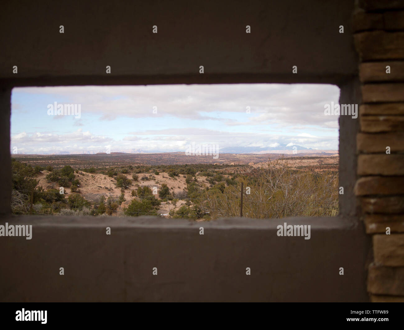 Rectangular window frames a sparse desert landscape Stock Photo - Alamy