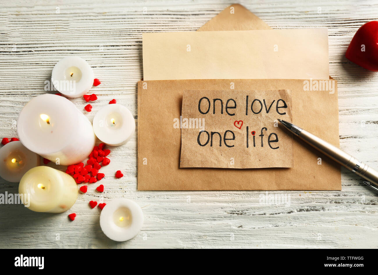 Gift card for Valentine's Day with inscription, pen and candles on ...