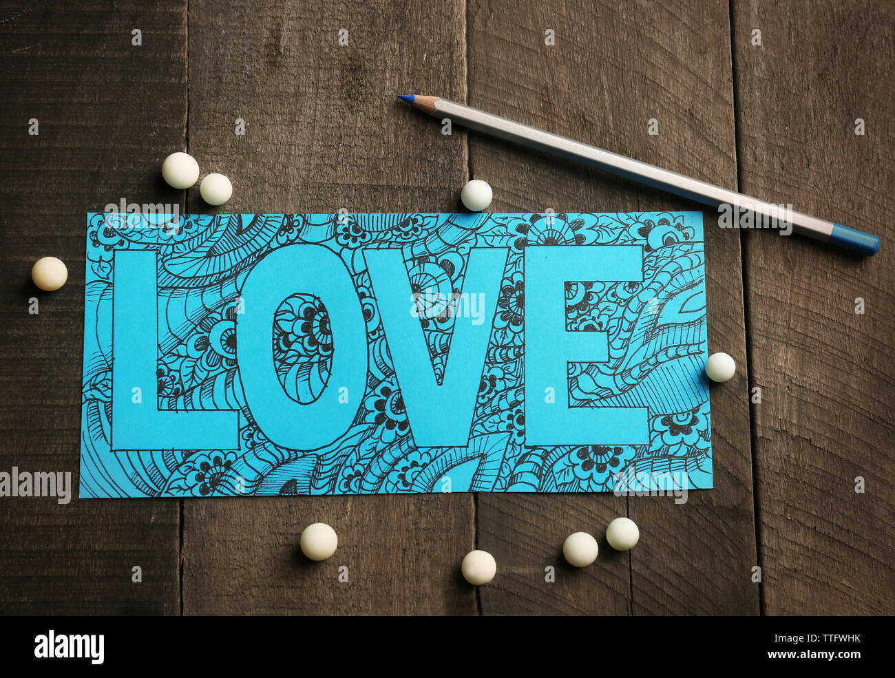 Blue gift card with love doodle drawing on wooden background Stock ...
