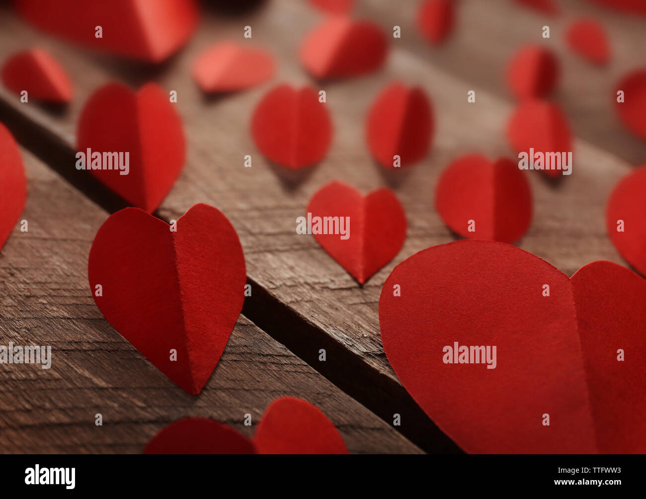 Red paper hearts on wooden background, close up Stock Photo - Alamy