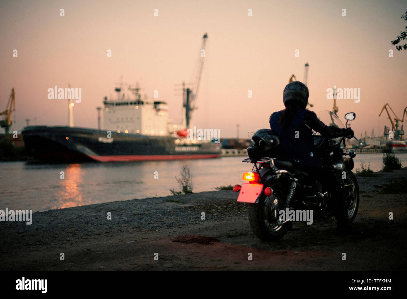 Rear view riding motorcycle hi-res stock photography and images - Alamy