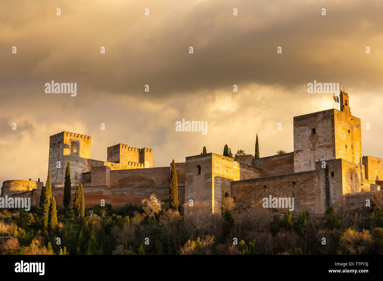 Alhambra castle lit by golden sunshine Stock Photo - Alamy