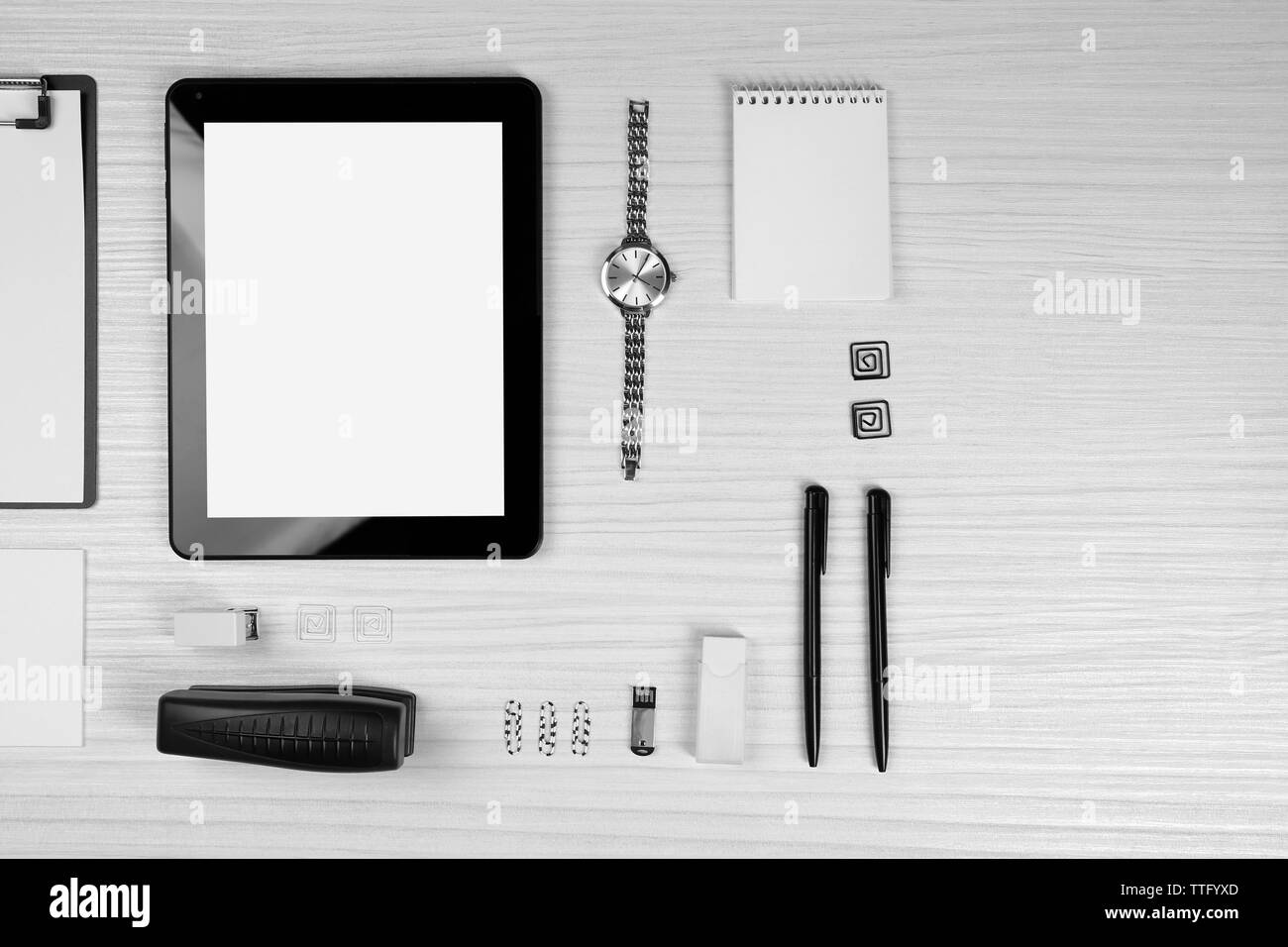 Office set with sheets of paper, tablet and stationery on light wooden ...