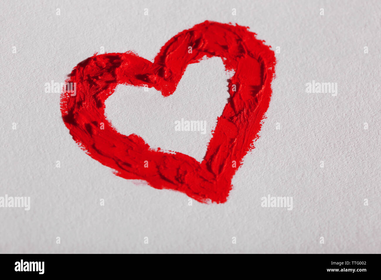 Red heart painted on light background Stock Photo - Alamy