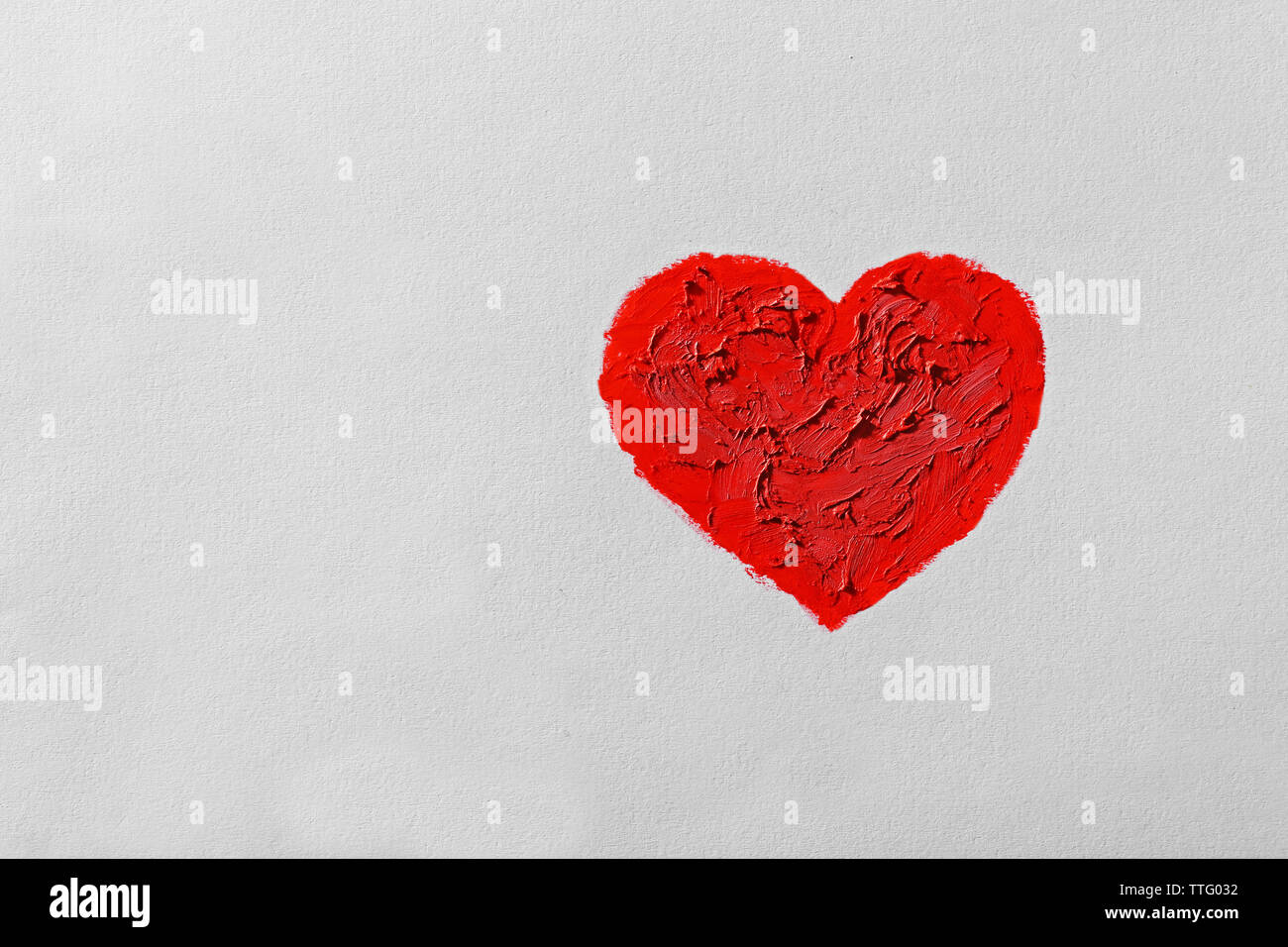 Red heart painted on light background Stock Photo - Alamy
