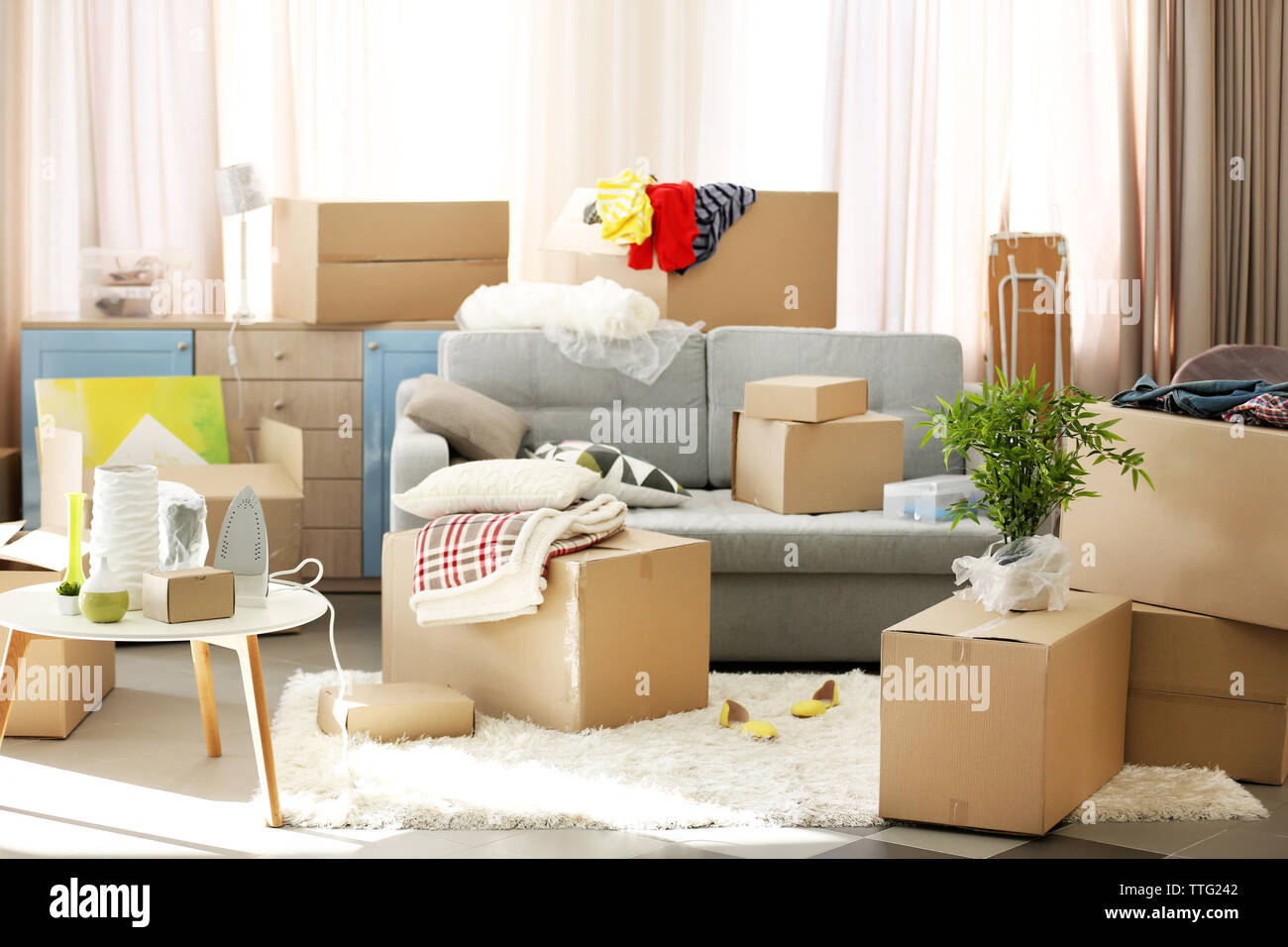 Packed household goods for moving into new house Stock Photo - Alamy