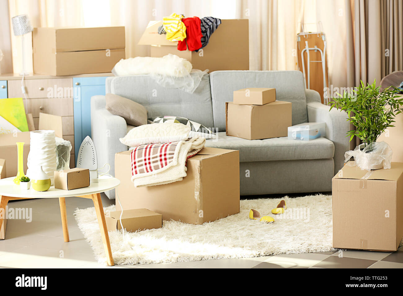 Packed household goods for moving into new house Stock Photo - Alamy