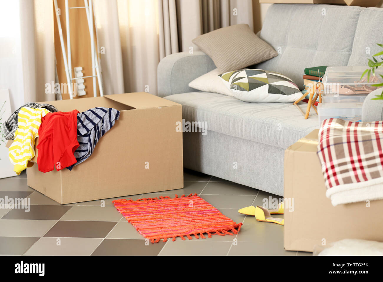 Packed household goods for moving into new house Stock Photo - Alamy