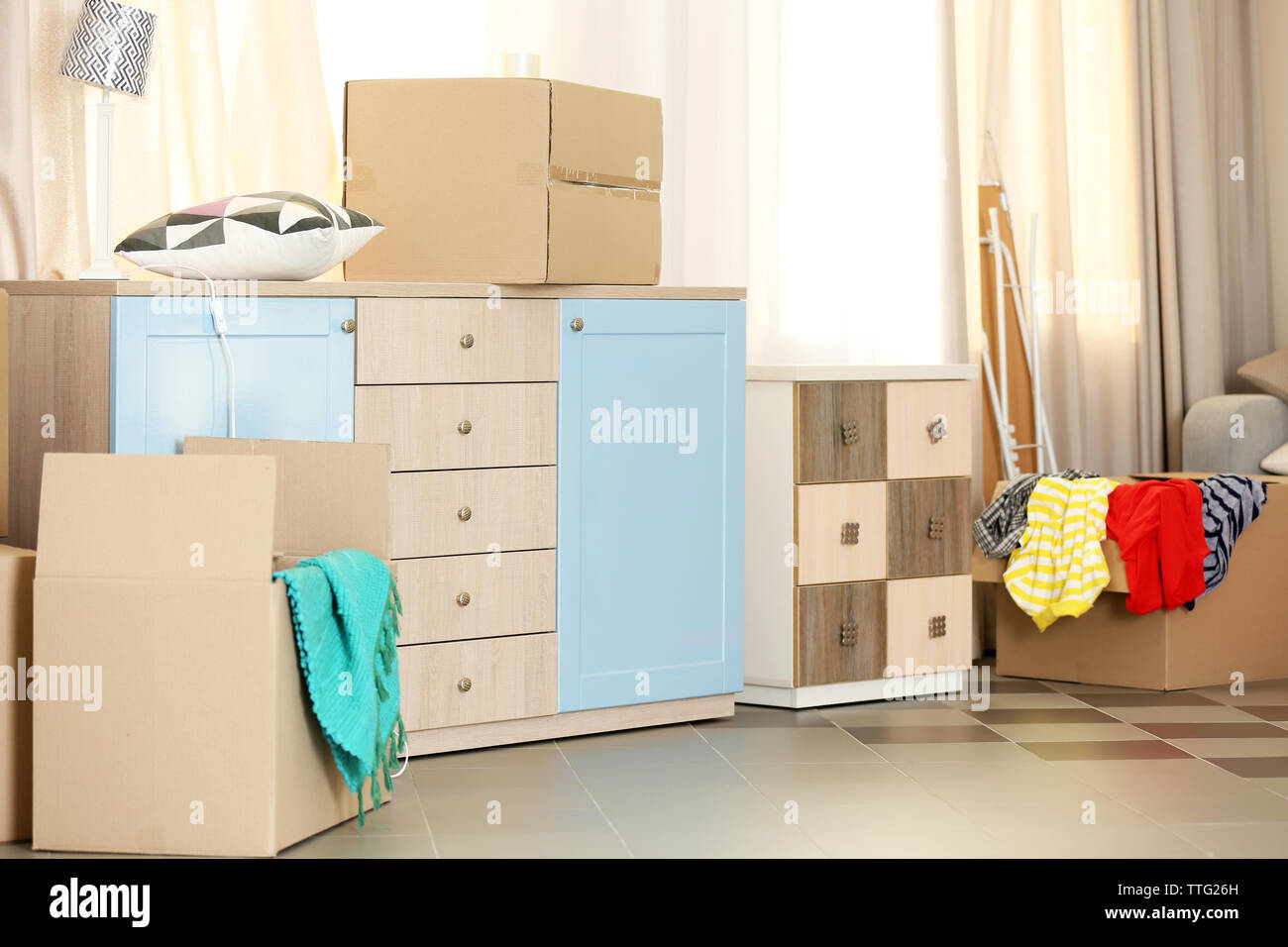 Packed household goods for moving into new house Stock Photo - Alamy