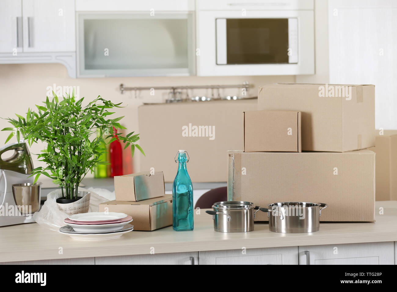 Packed household goods for moving into new house Stock Photo - Alamy