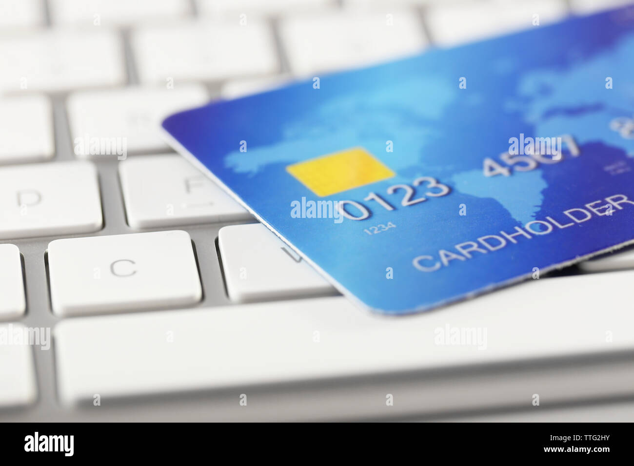 Credit card on keyboard, close up Stock Photo - Alamy