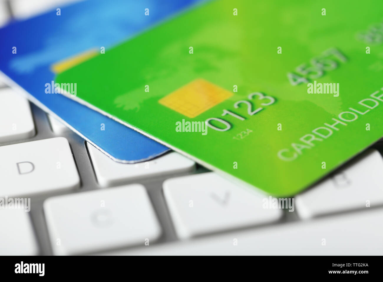 Credit cards on keyboard, close up Stock Photo - Alamy