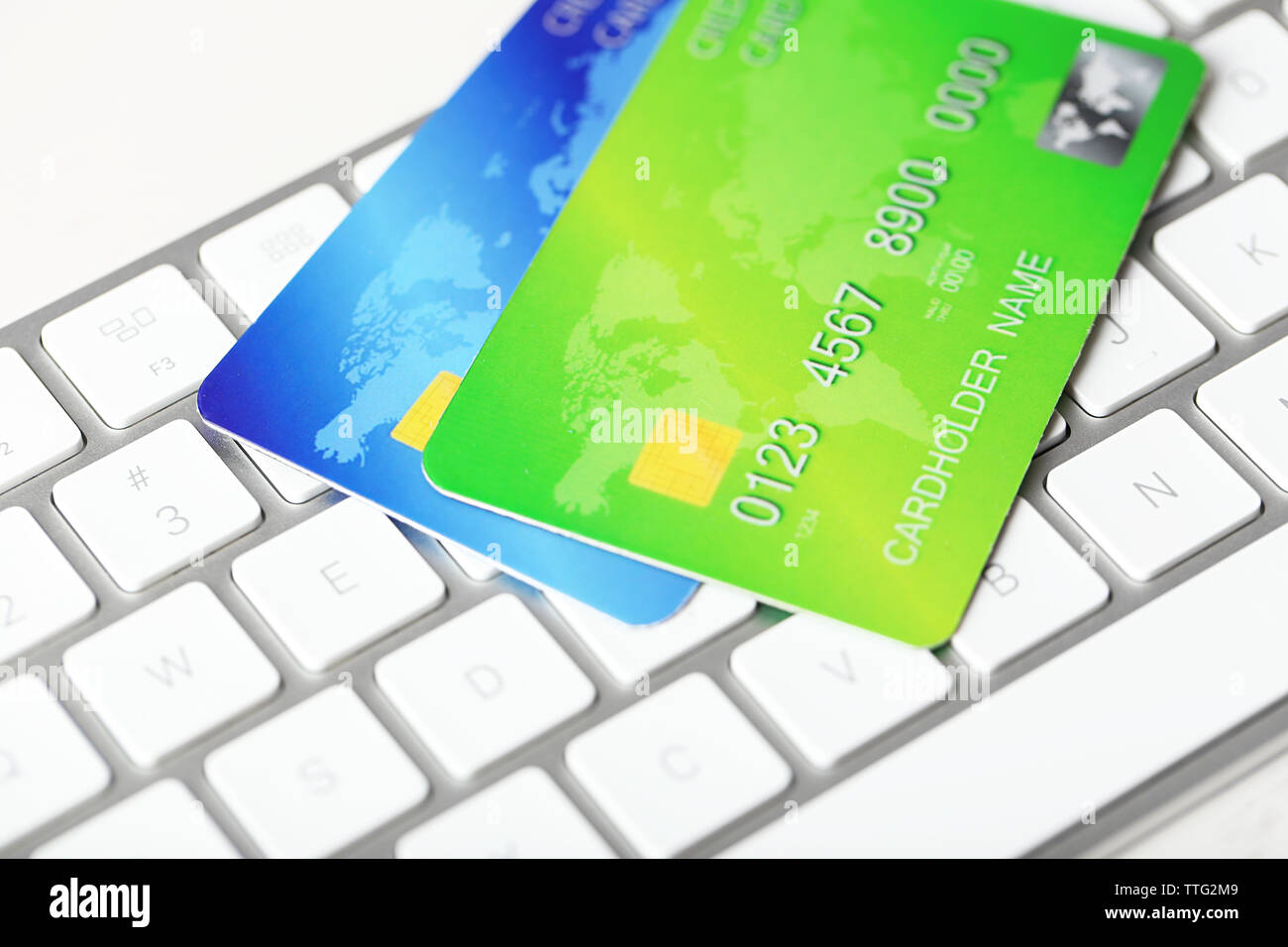 Credit cards on keyboard, close up Stock Photo - Alamy