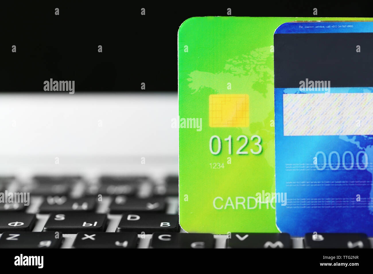 Credit cards on keyboard, close up Stock Photo - Alamy
