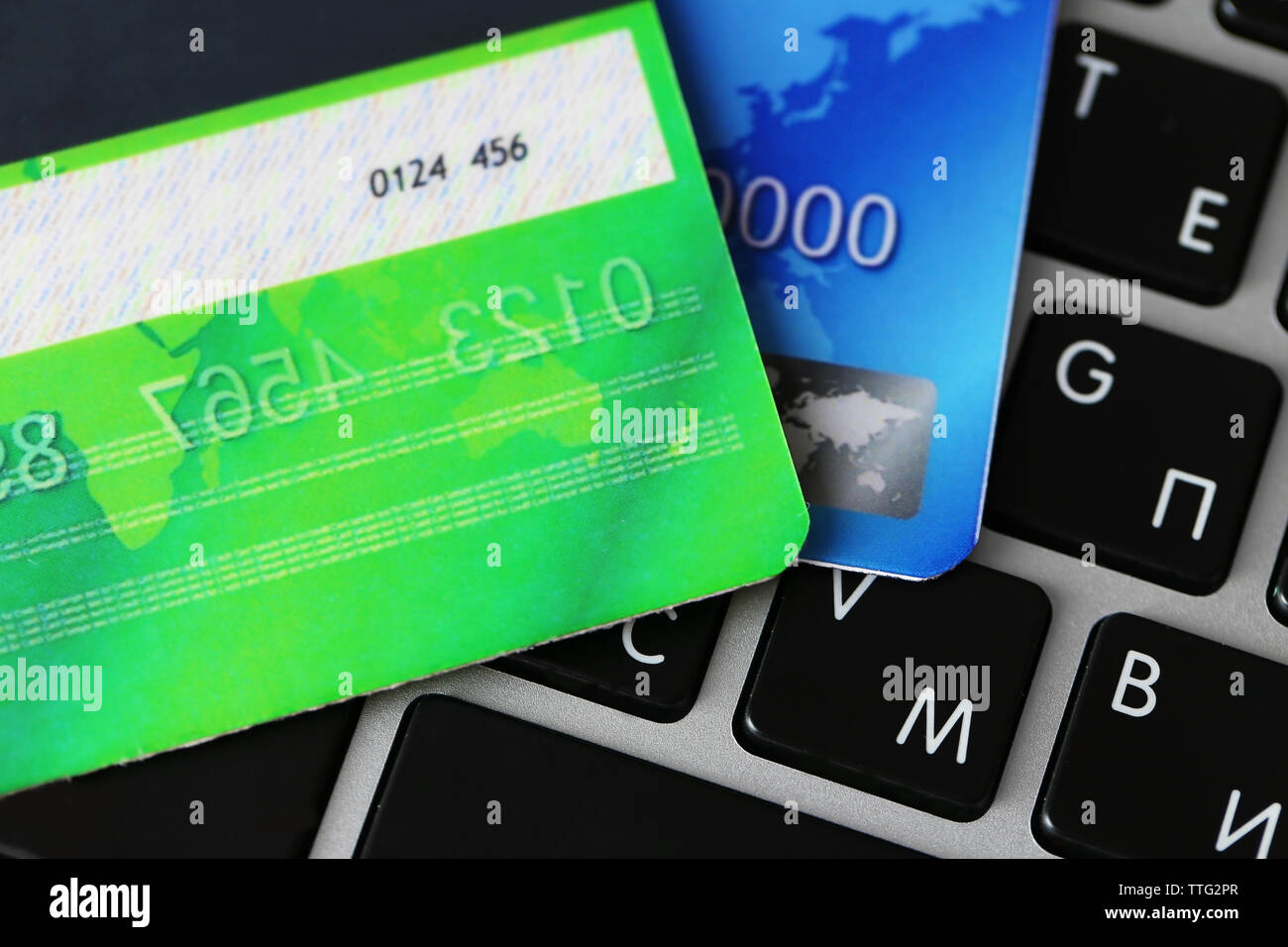 Credit cards on keyboard, close up Stock Photo - Alamy