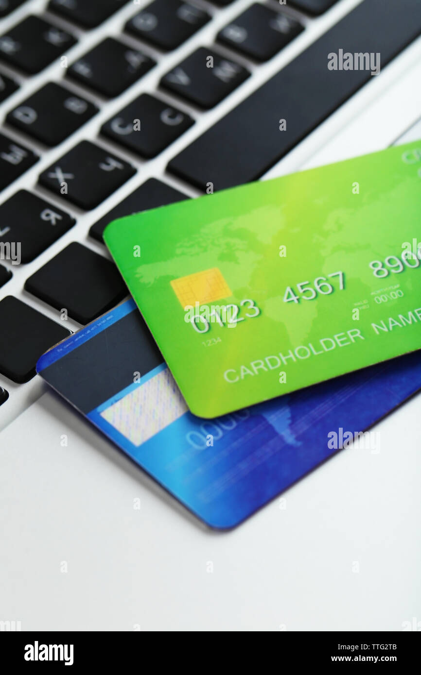 Credit cards on keyboard, close up Stock Photo - Alamy