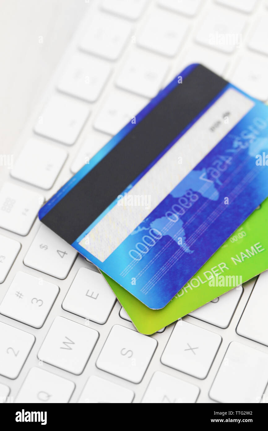 Credit cards on keyboard, close up Stock Photo - Alamy